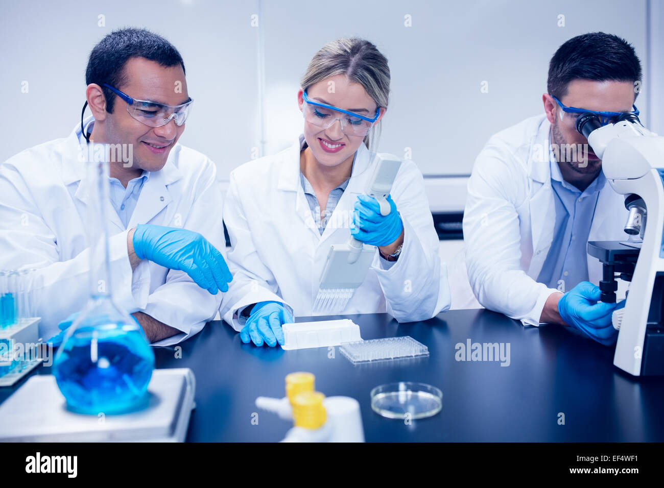 Science students working together in the lab Stock Photo - Alamy