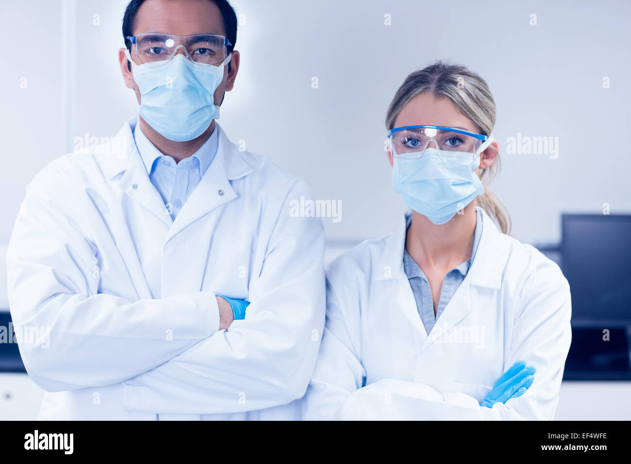 Science students wearing protective masks Stock Photo - Alamy