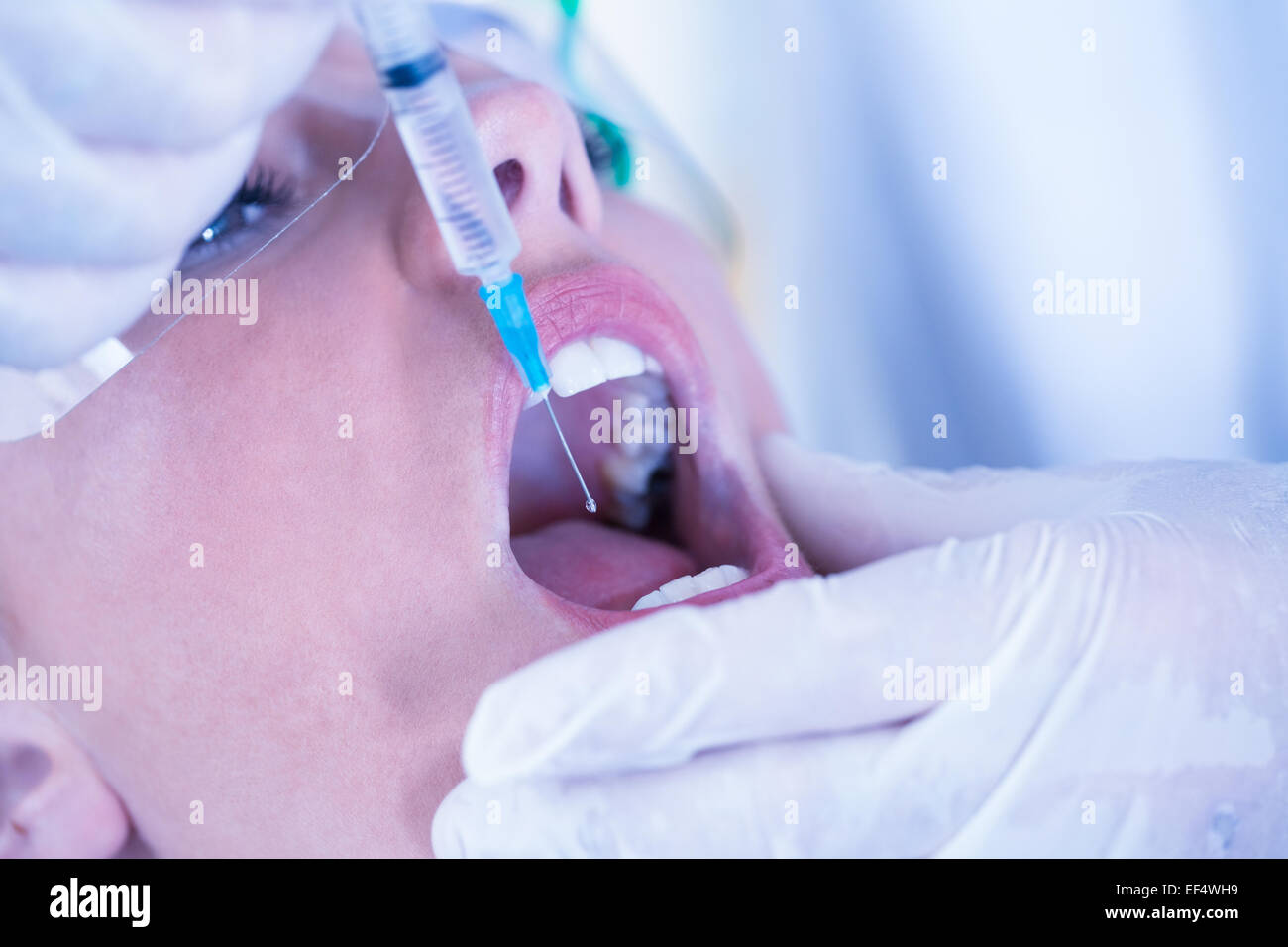 Close up of a patient with mouth open and syringe for injection Stock ...