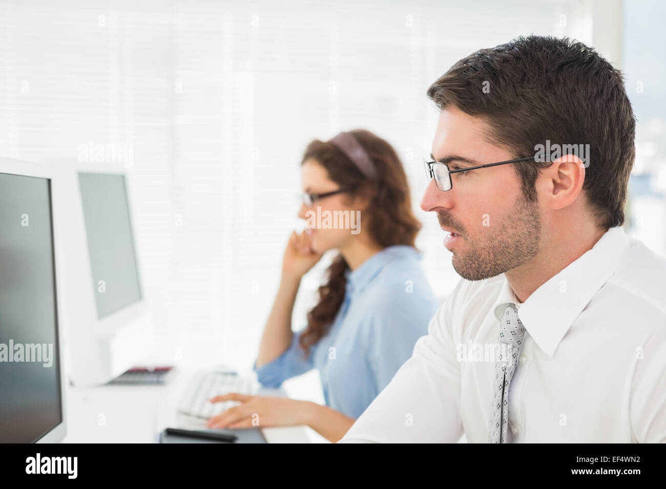 Business colleagues with glasses using computer Stock Photo - Alamy