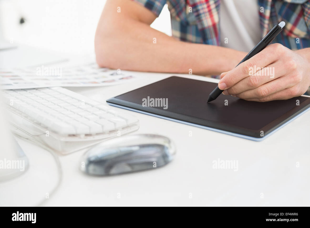 Designer using digitizer at desk Stock Photo - Alamy