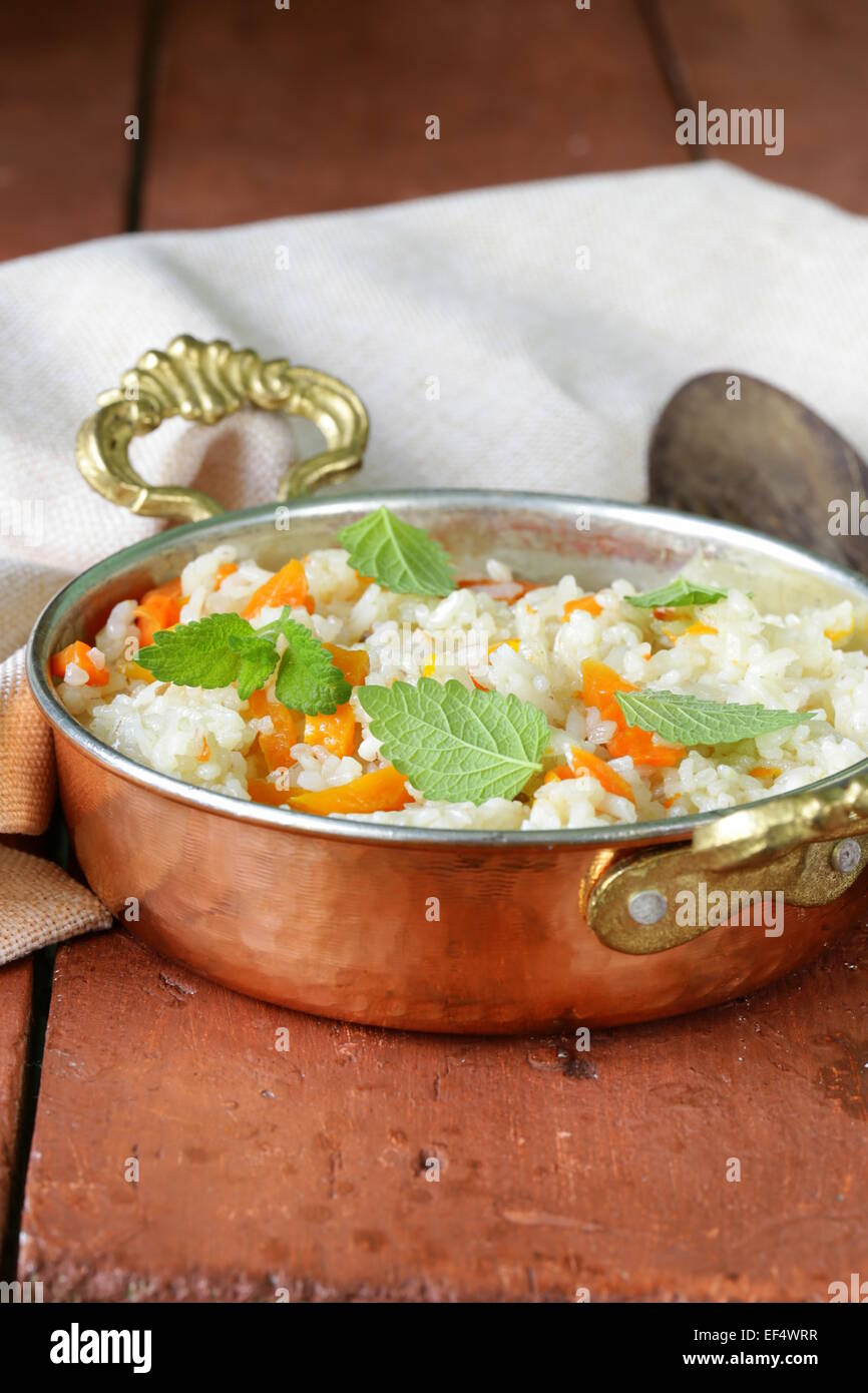 rice with vegetables cooked in Indian style in a copper pan Stock Photo ...
