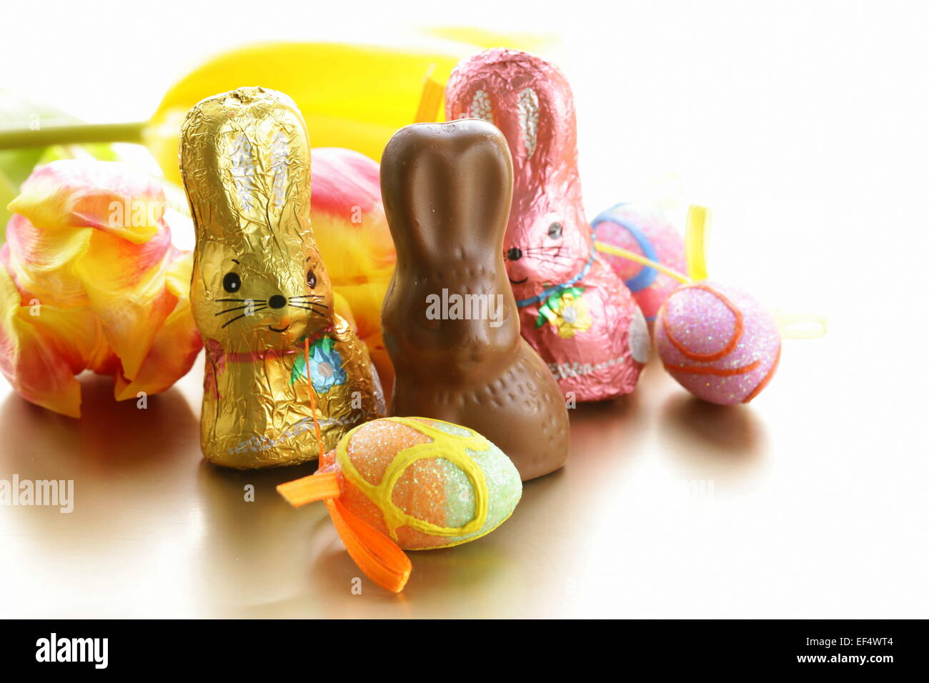chocolate Easter bunny candy (sweets) with tulips Stock Photo - Alamy