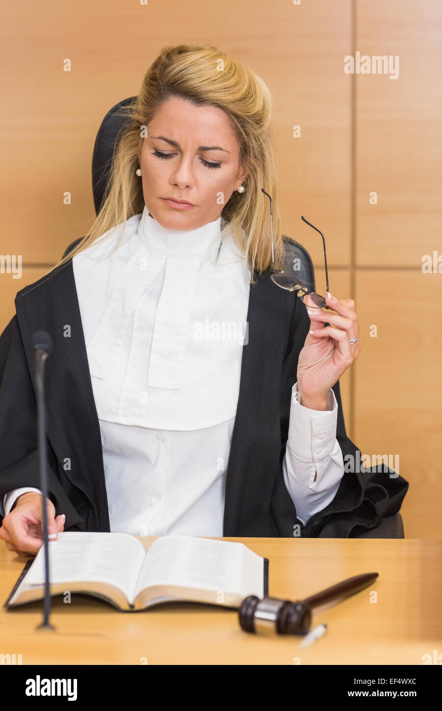 Stern judge reading her notes Stock Photo - Alamy