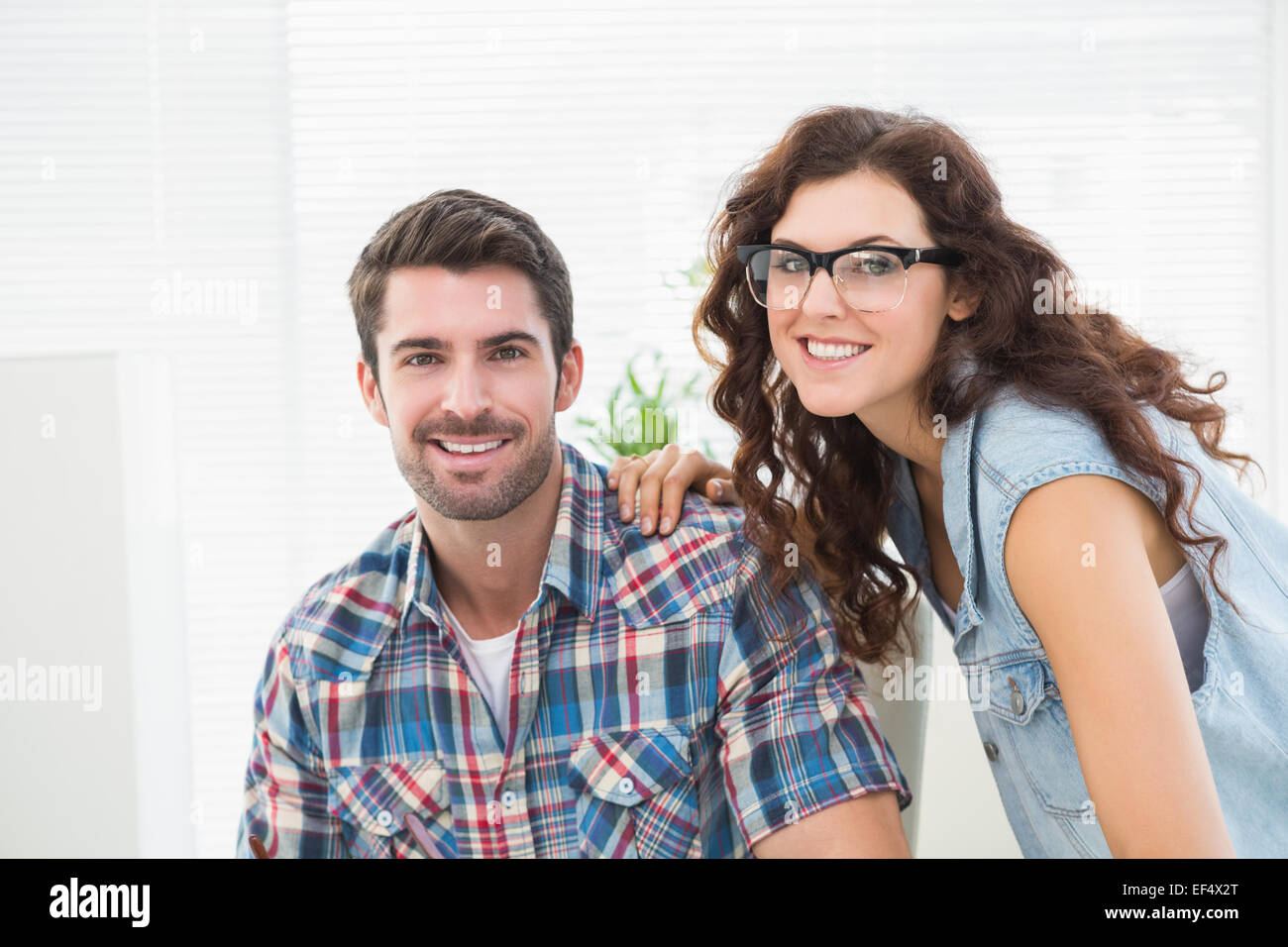 Portrait of smiling partners posing together Stock Photo - Alamy