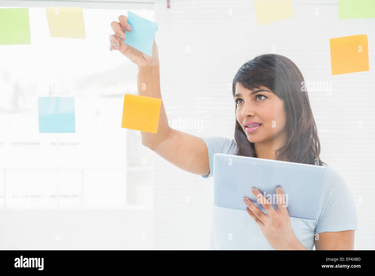 Woman holding sticky notes hi-res stock photography and images - Alamy