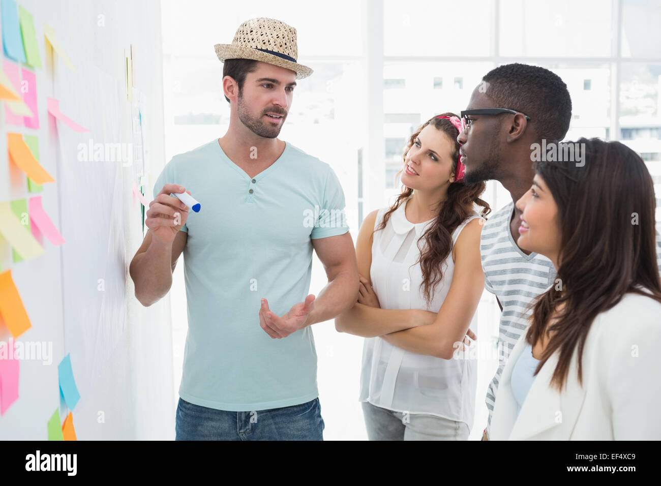 Teamwork standing and talking together Stock Photo - Alamy