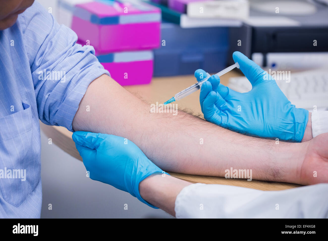 Man receiving a vaccination hi-res stock photography and images - Alamy