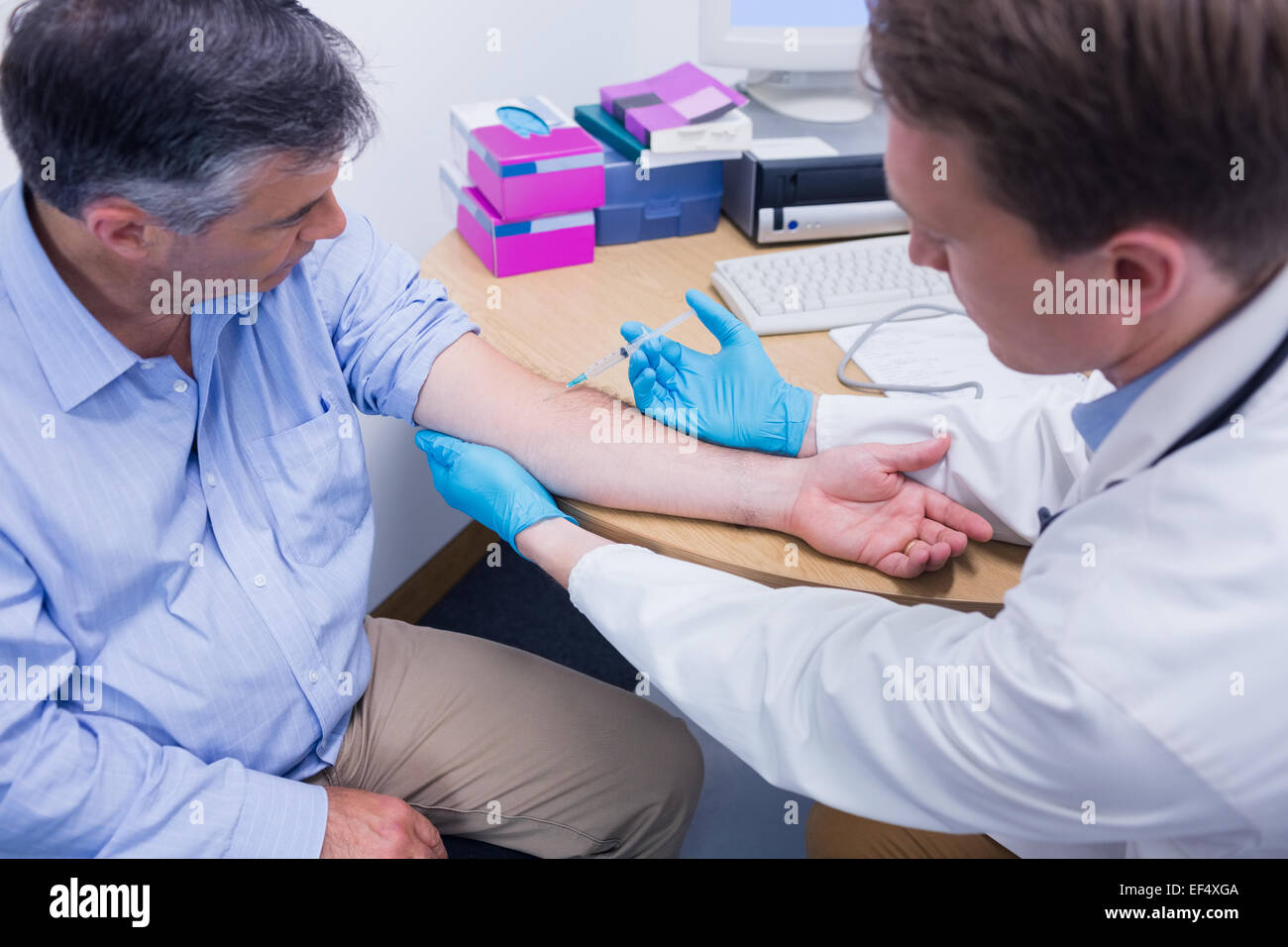 Close up of a patient receiving injection Stock Photo - Alamy