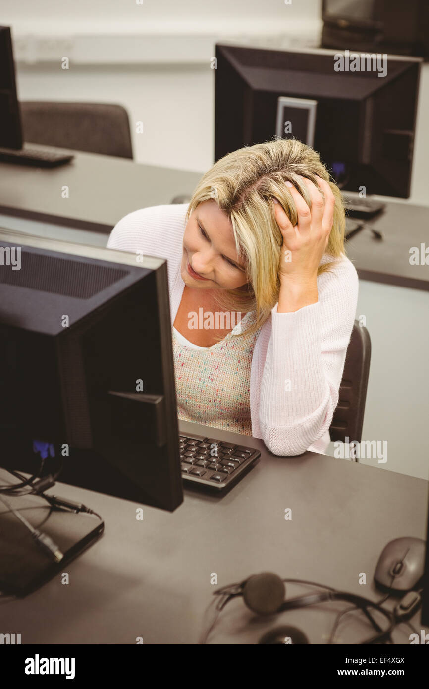 Confused student looking at computer screen Stock Photo - Alamy