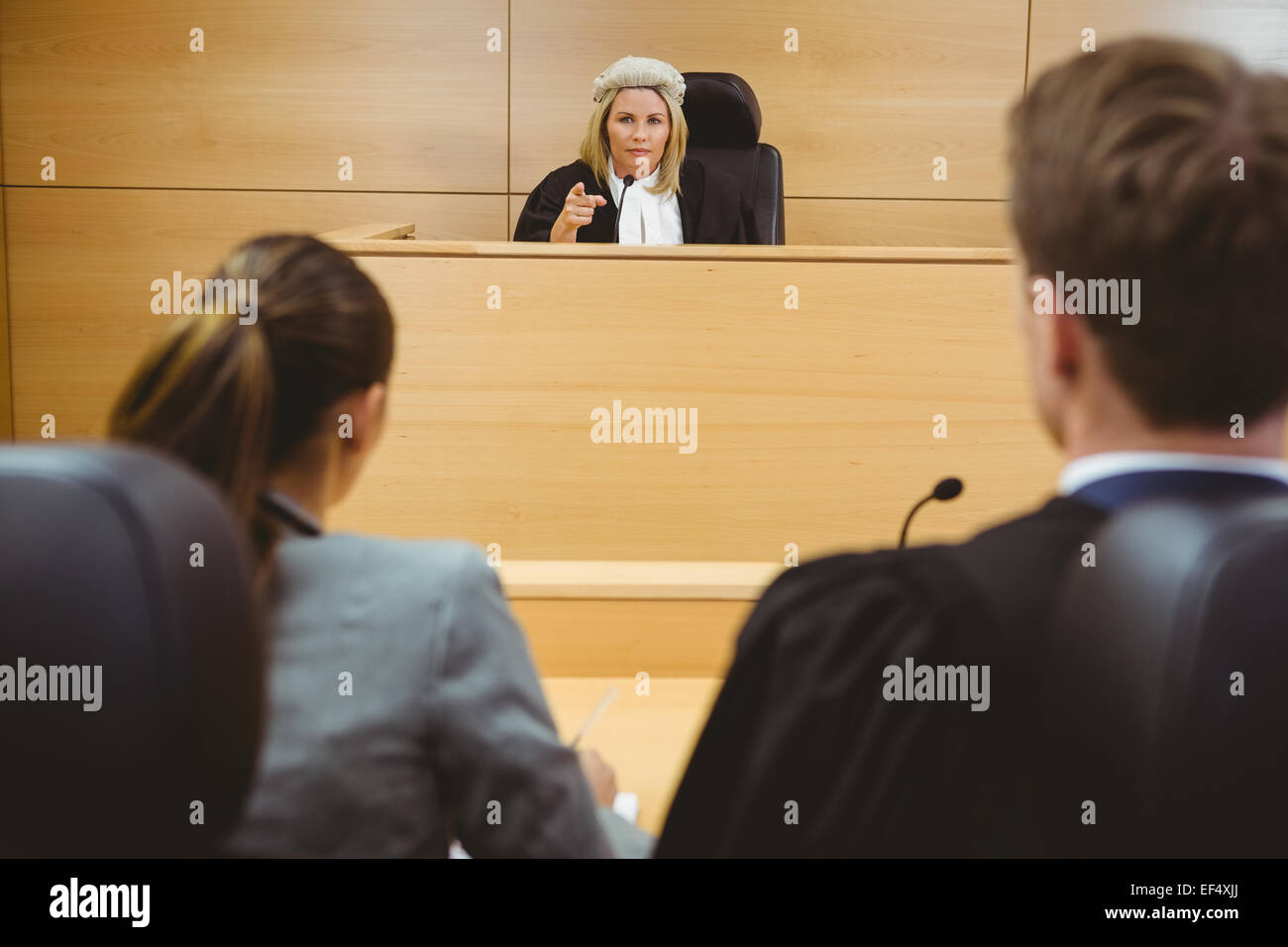 Judge talking with lawyers to make a decision Stock Photo - Alamy