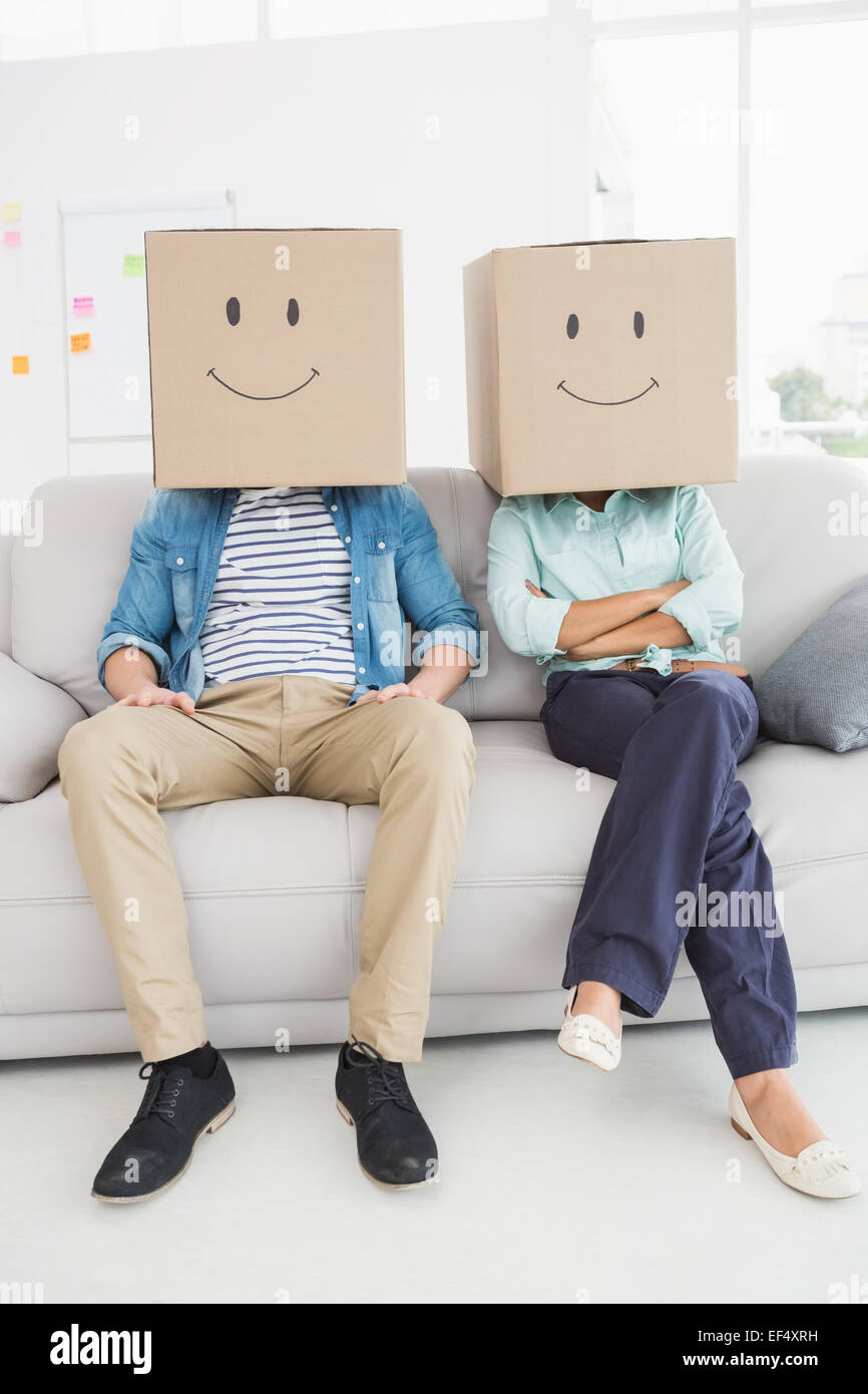 Teamwork on sofa with smiling face Stock Photo - Alamy