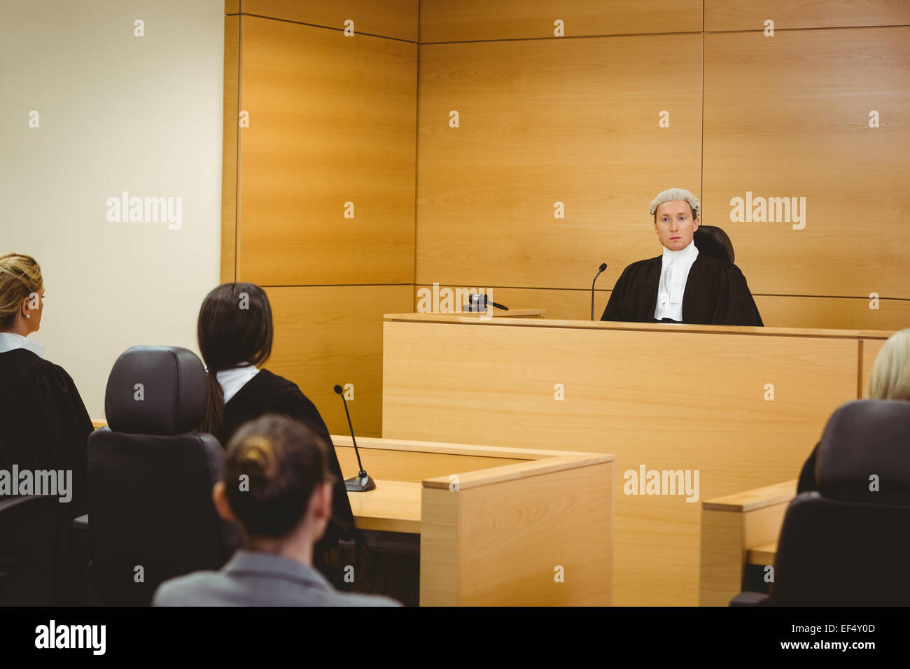 Unsmiling judge wearing looking at camera Stock Photo - Alamy