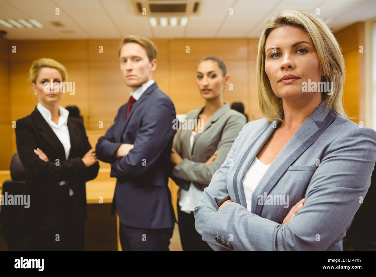 Serious lawyer standing with arms crossed Stock Photo - Alamy