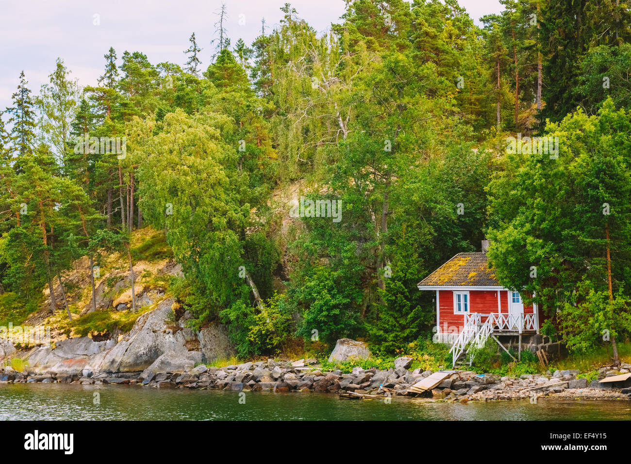 Red Finnish Wooden Sauna Log Cabin On Island In Summer Stock Photo - Alamy