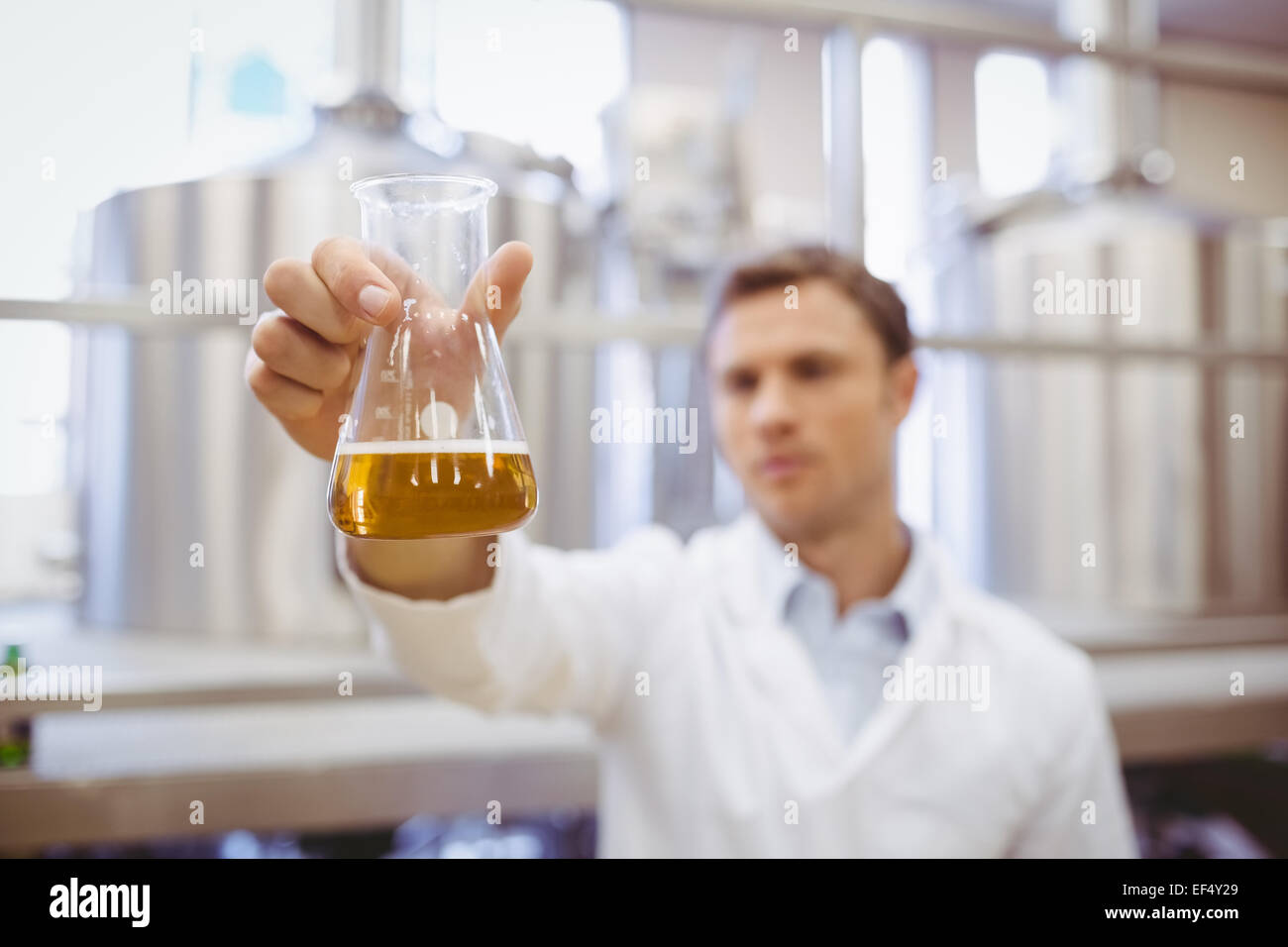 Scientist holding beaker hi-res stock photography and images - Alamy
