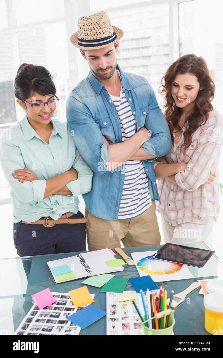 Cheerful teamwork standing with arms crossed Stock Photo - Alamy