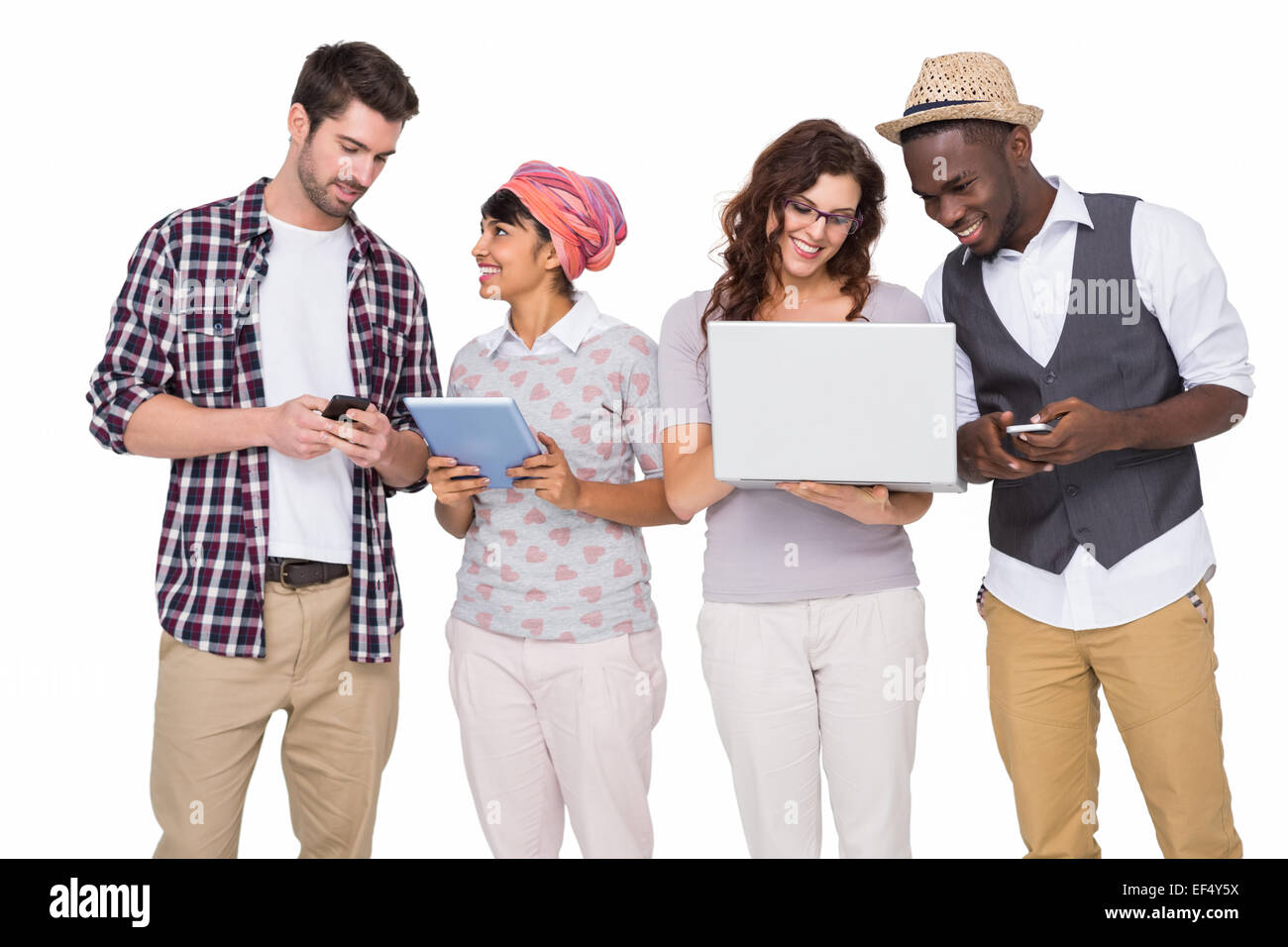 Smiling coworkers with technology interacting together Stock Photo - Alamy