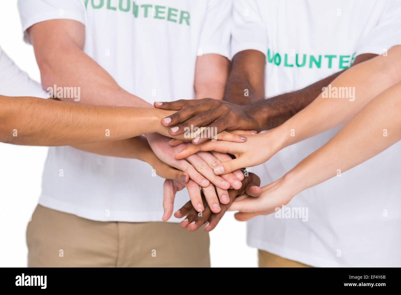 Teamwork with hands together standing Stock Photo - Alamy