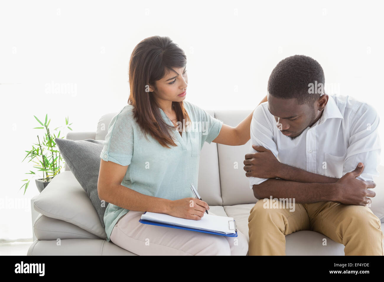 Therapist reassuring her upset patient Stock Photo - Alamy