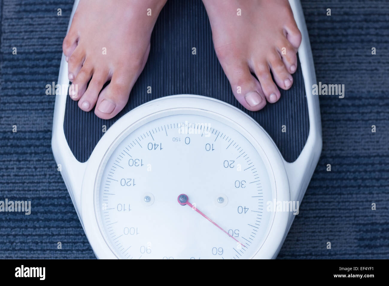 Feet on scales hi-res stock photography and images - Alamy