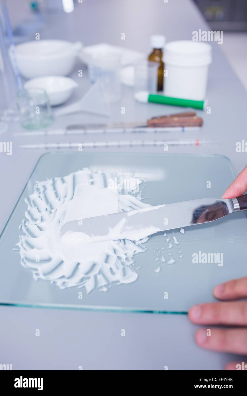 Close up of a biochemist making some medicine Stock Photo - Alamy