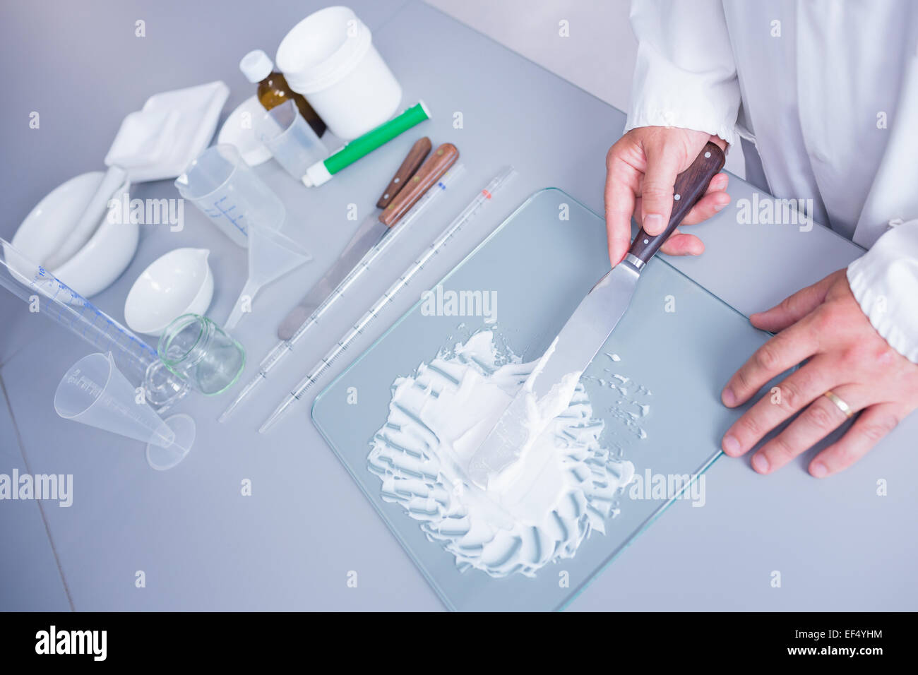 Close up of a biochemist making some medicine Stock Photo - Alamy