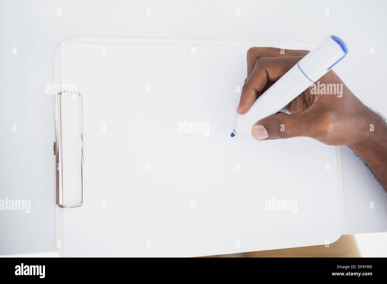 Hand of businessman writing on notepad with marker Stock Photo - Alamy