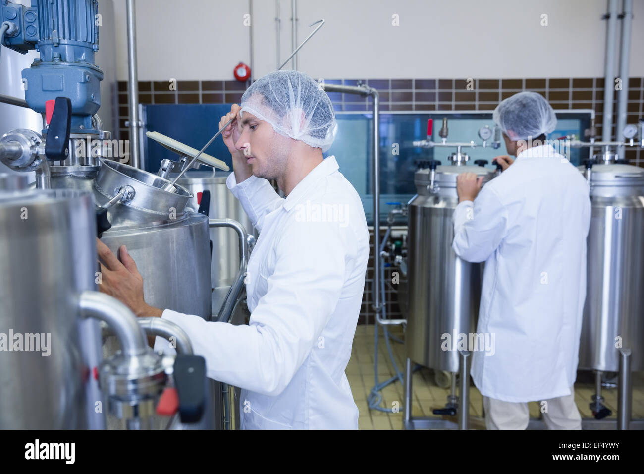 Scientists wearing lab coat and hair net Stock Photo - Alamy