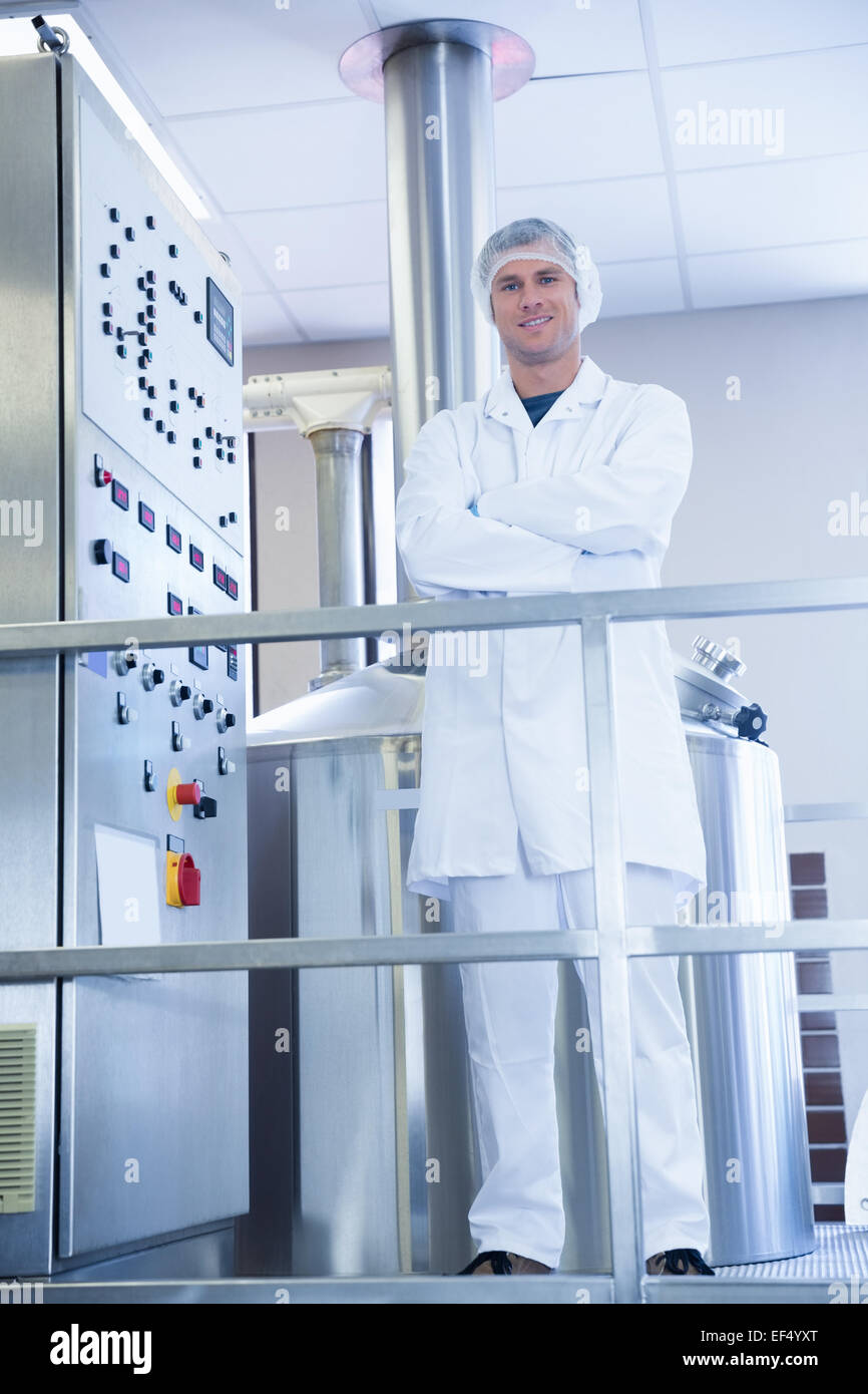 Smiling scientist standing with arms crossed Stock Photo - Alamy