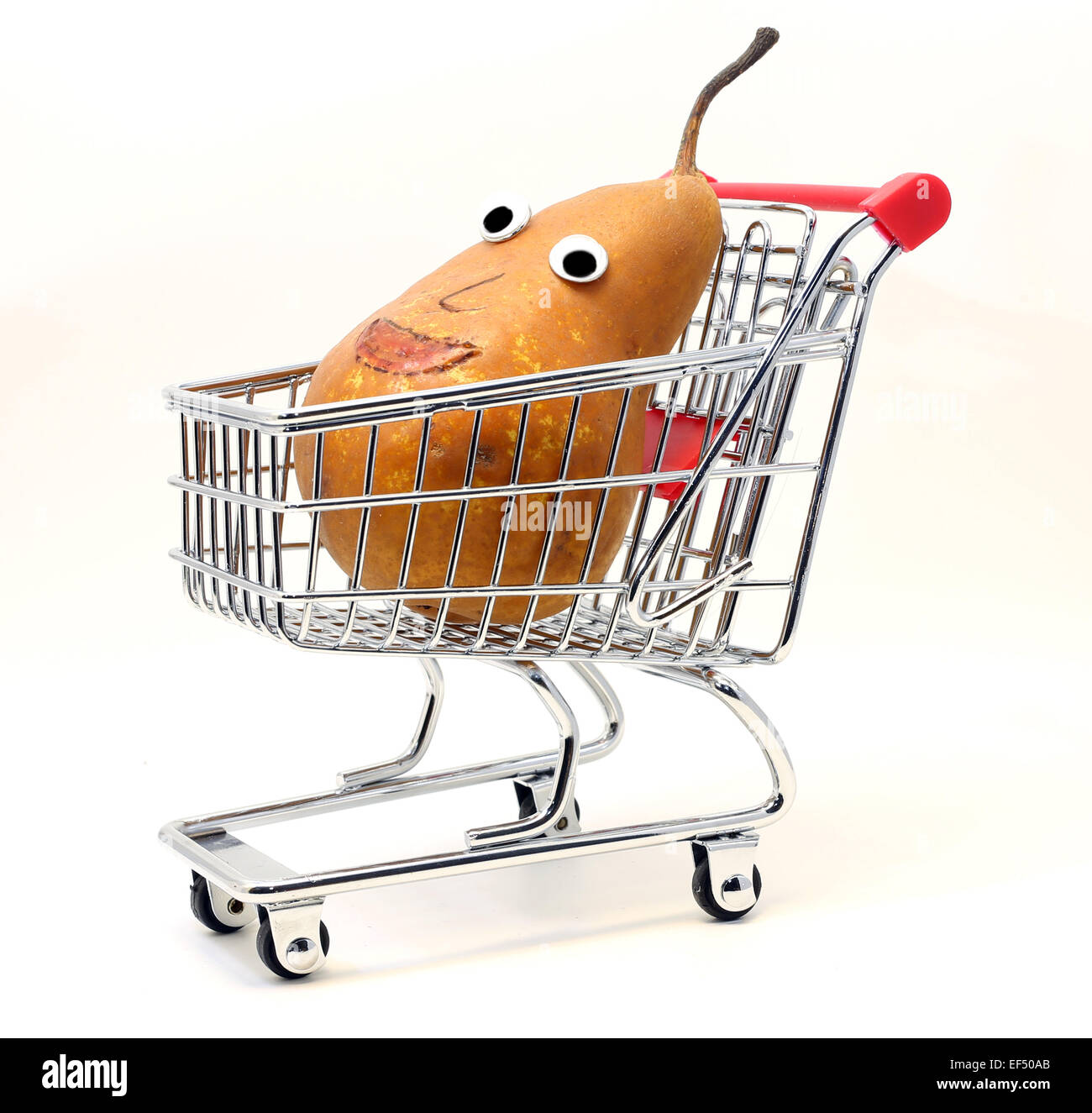 Pear with eyes inside the shopping cart with big eyes Stock Photo - Alamy