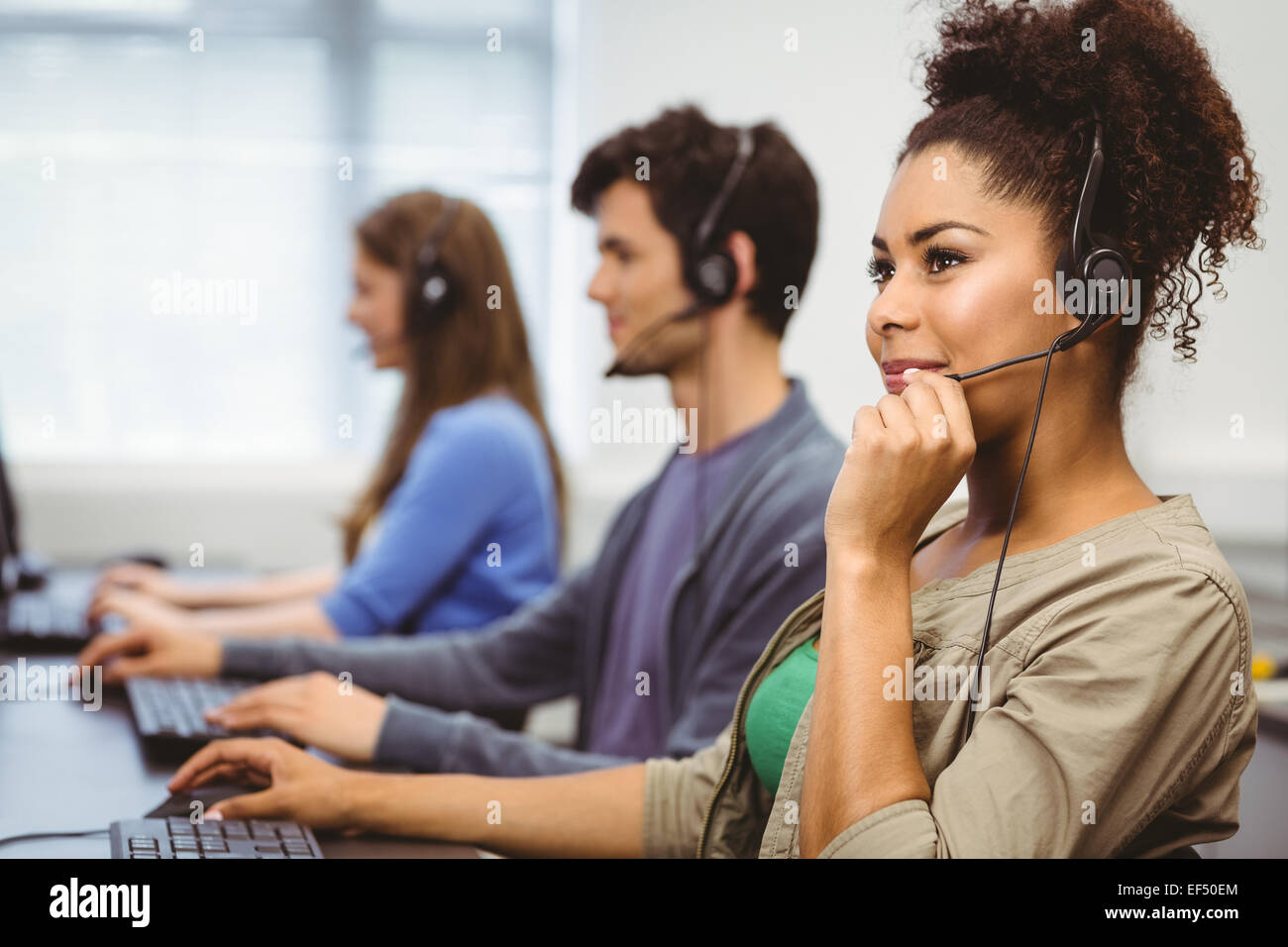 Happy student smiling in computer class Stock Photo - Alamy