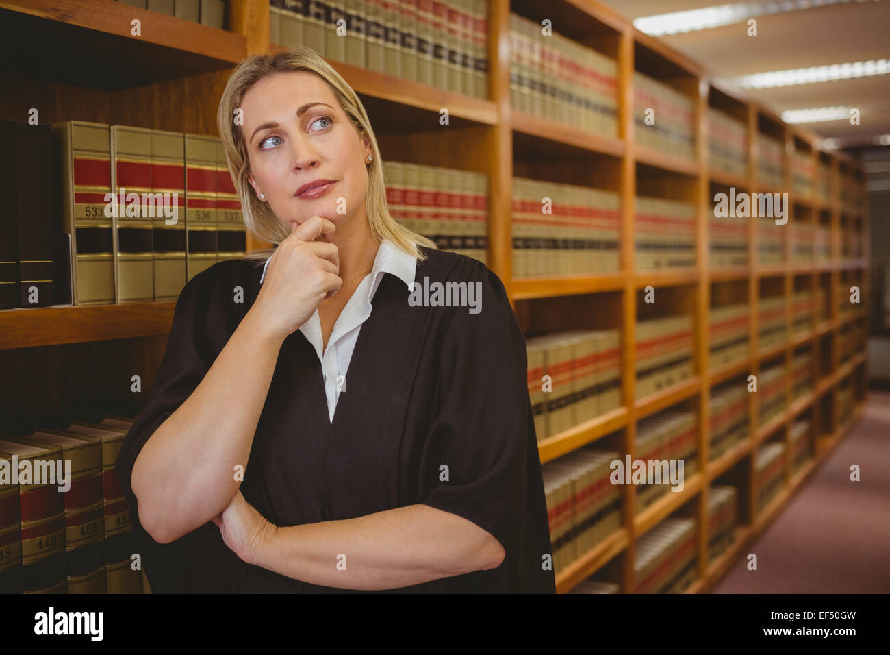 Serious lawyer thinking with hand on chin Stock Photo - Alamy