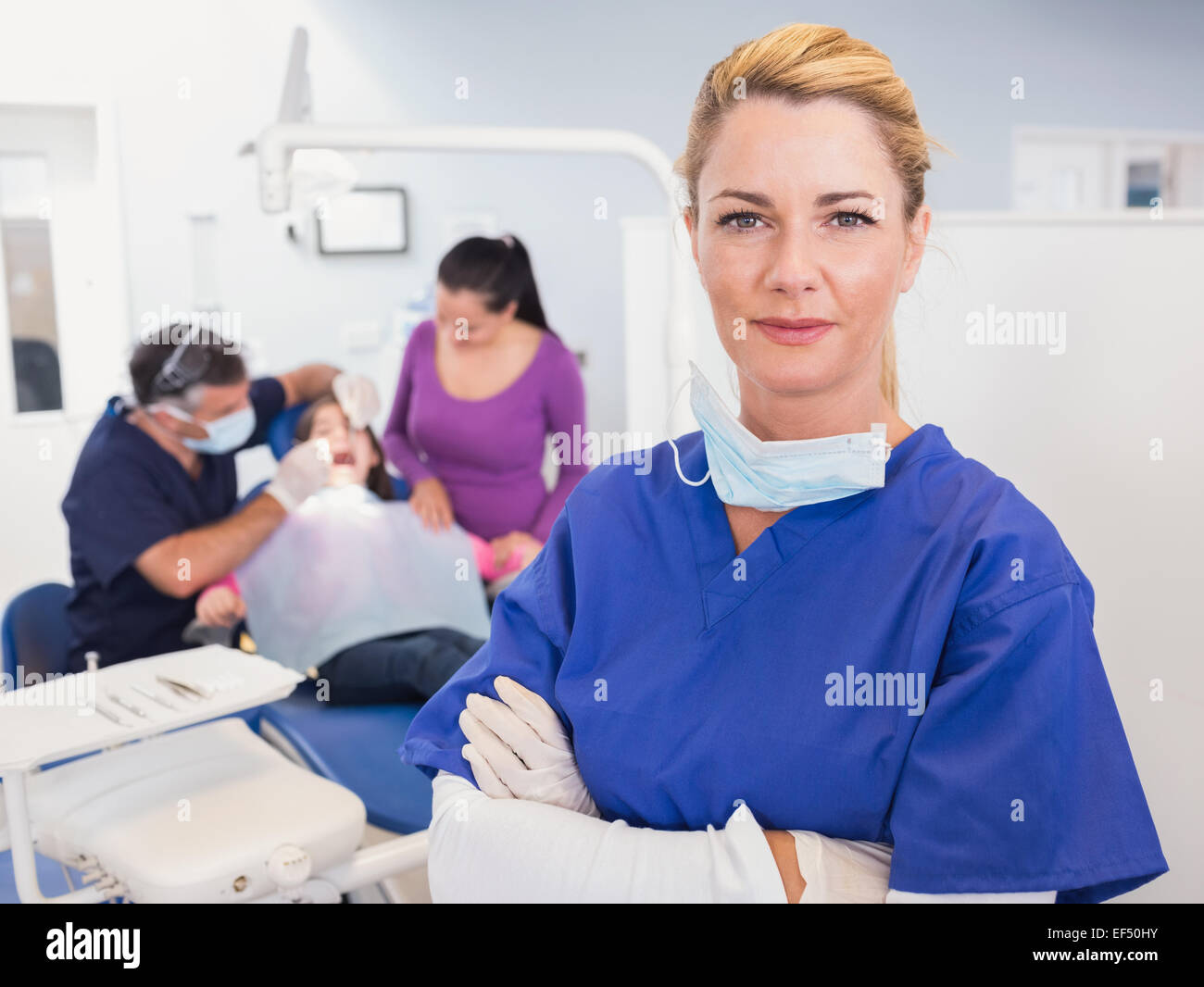 Dentist with folded arms Stock Photo - Alamy