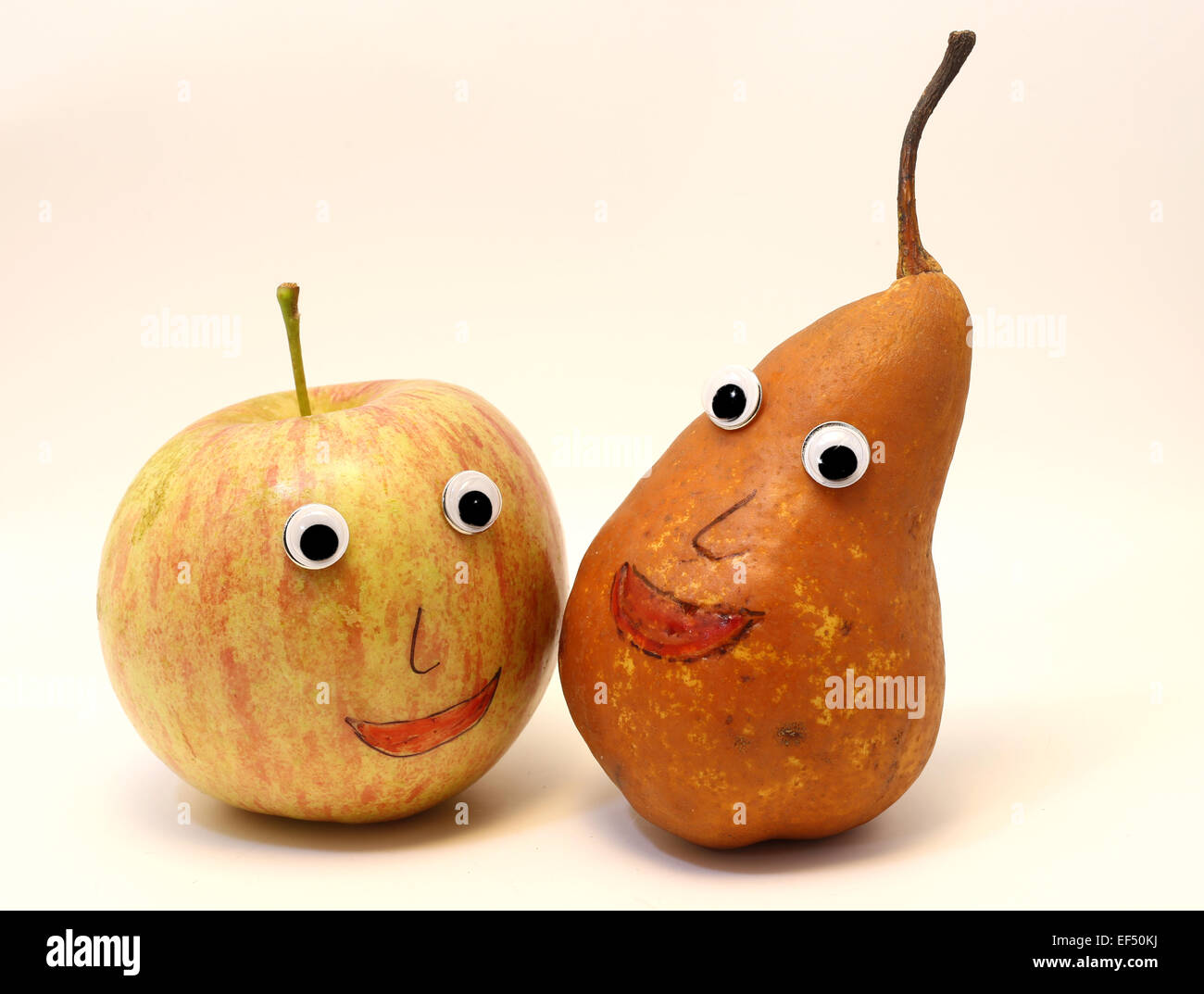 funny pair of fruits Apple and PEAR with big eyes Stock Photo - Alamy