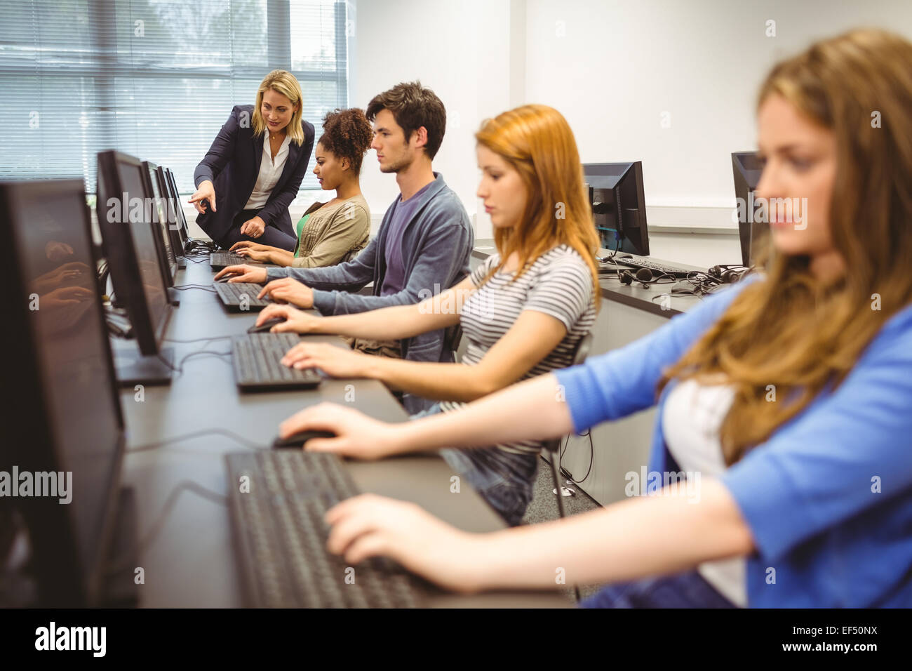 Helping to use a computer hi-res stock photography and images - Alamy