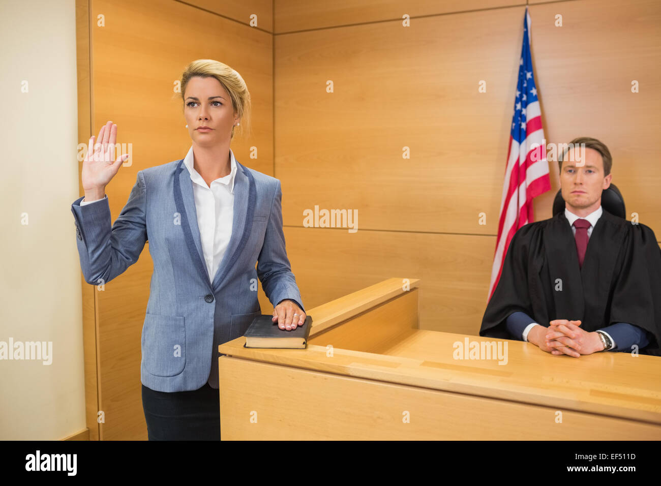 Witness taking an oath Stock Photo - Alamy