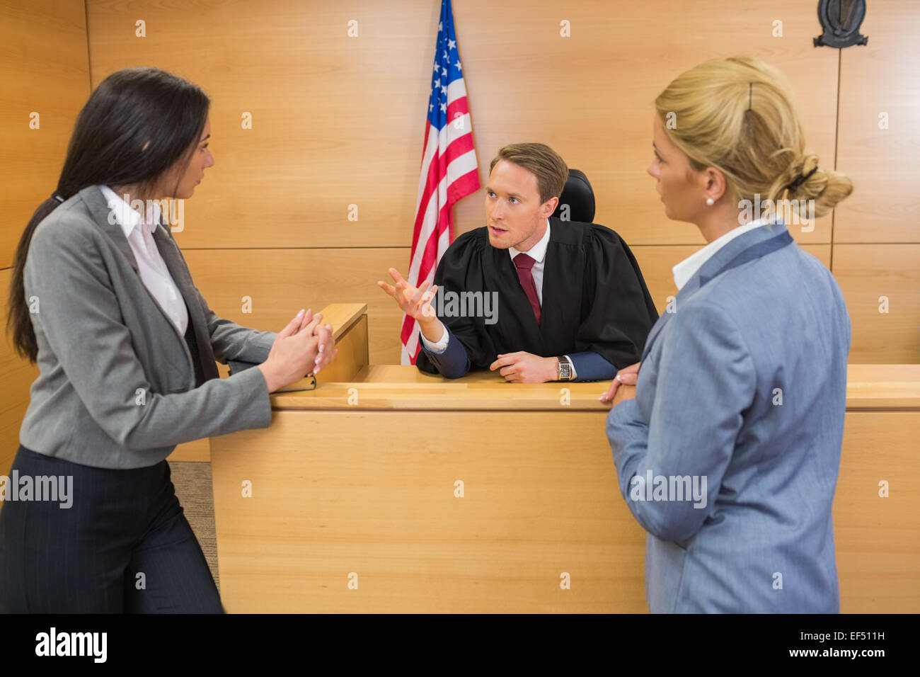 Lawyers speaking with the judge Stock Photo - Alamy