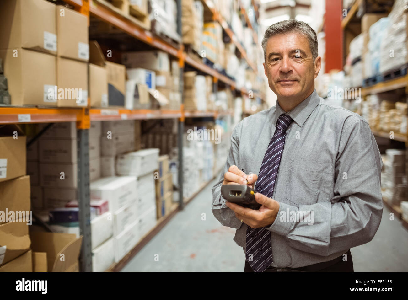 Businessman using handheld device hi-res stock photography and images ...