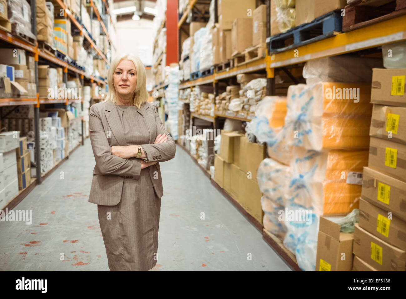 Serious female manager with arms crossed Stock Photo - Alamy