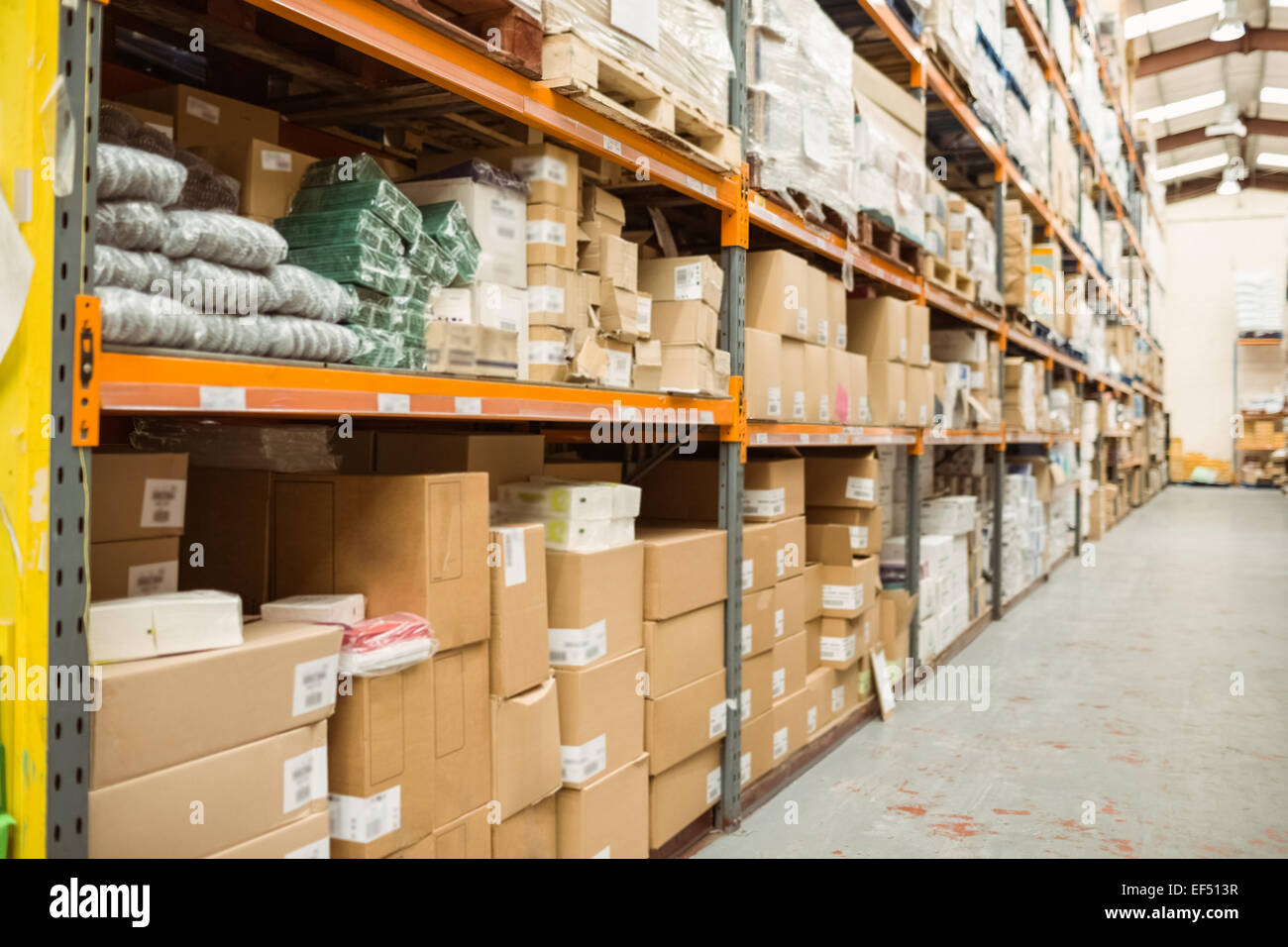 Shelves with boxes in warehouse Stock Photo - Alamy