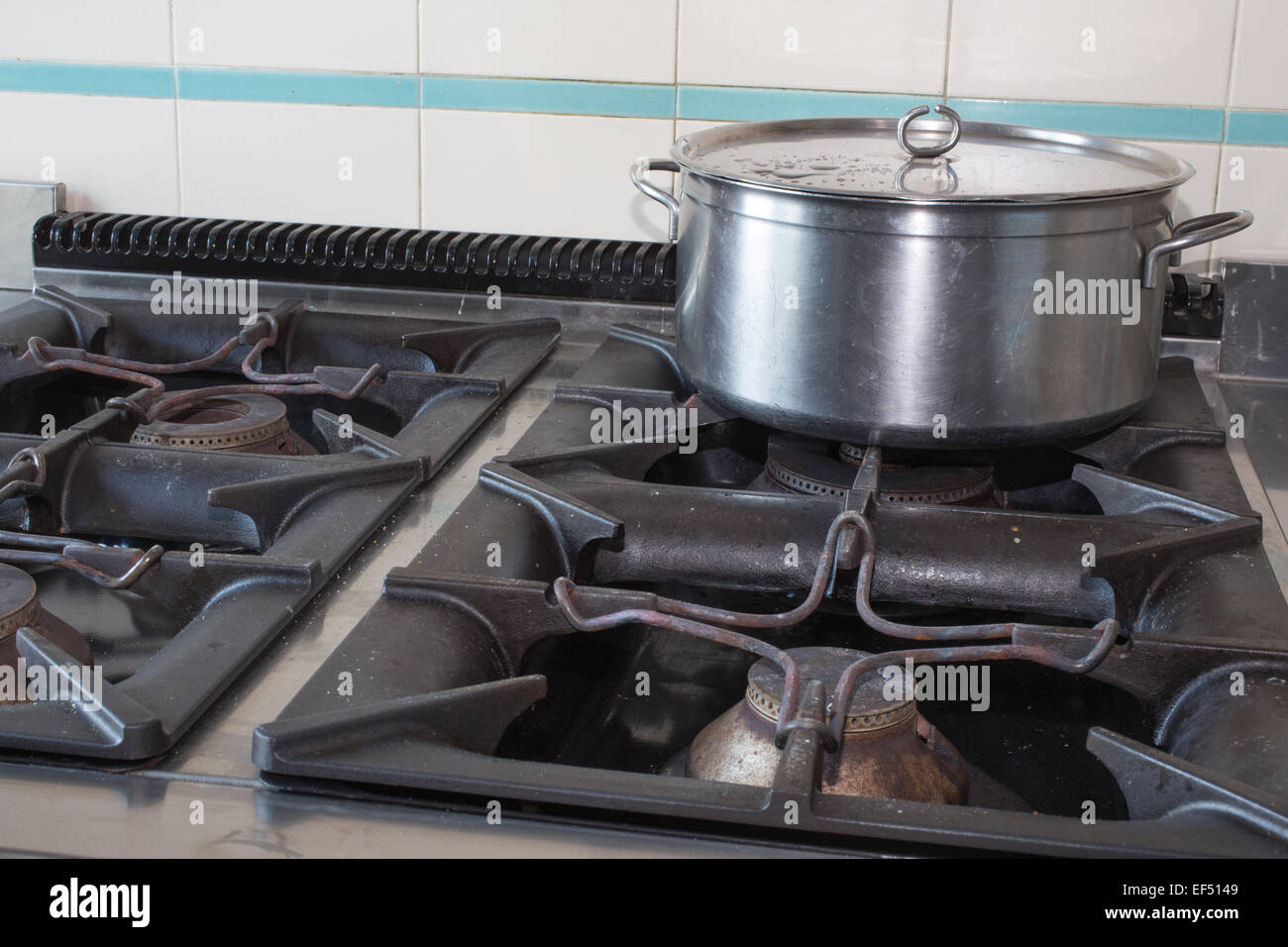 steel large pot over the stove of industrial kitchen Stock Photo - Alamy