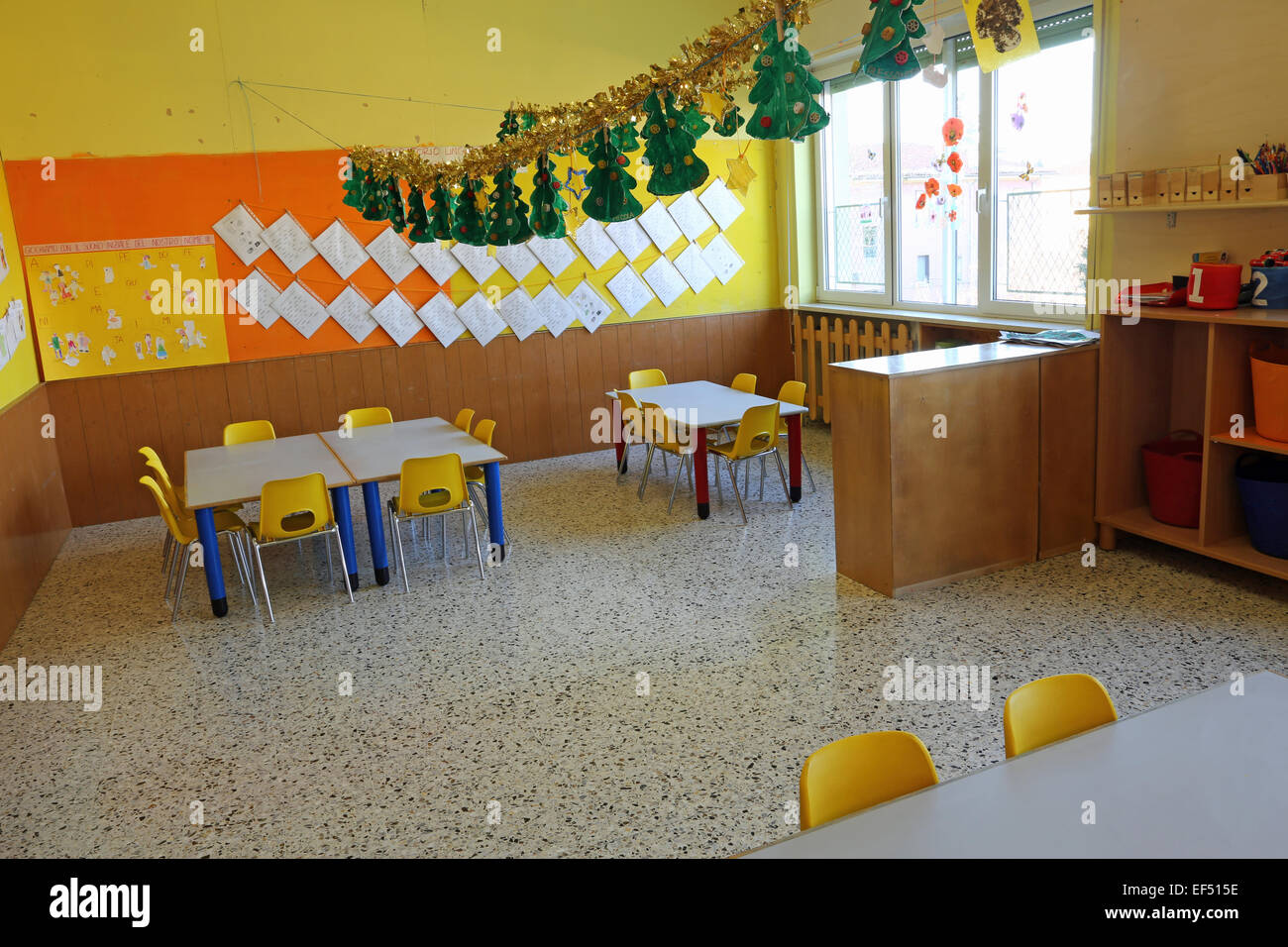 kindergarten classroom with yellow chairs and table Stock Photo - Alamy