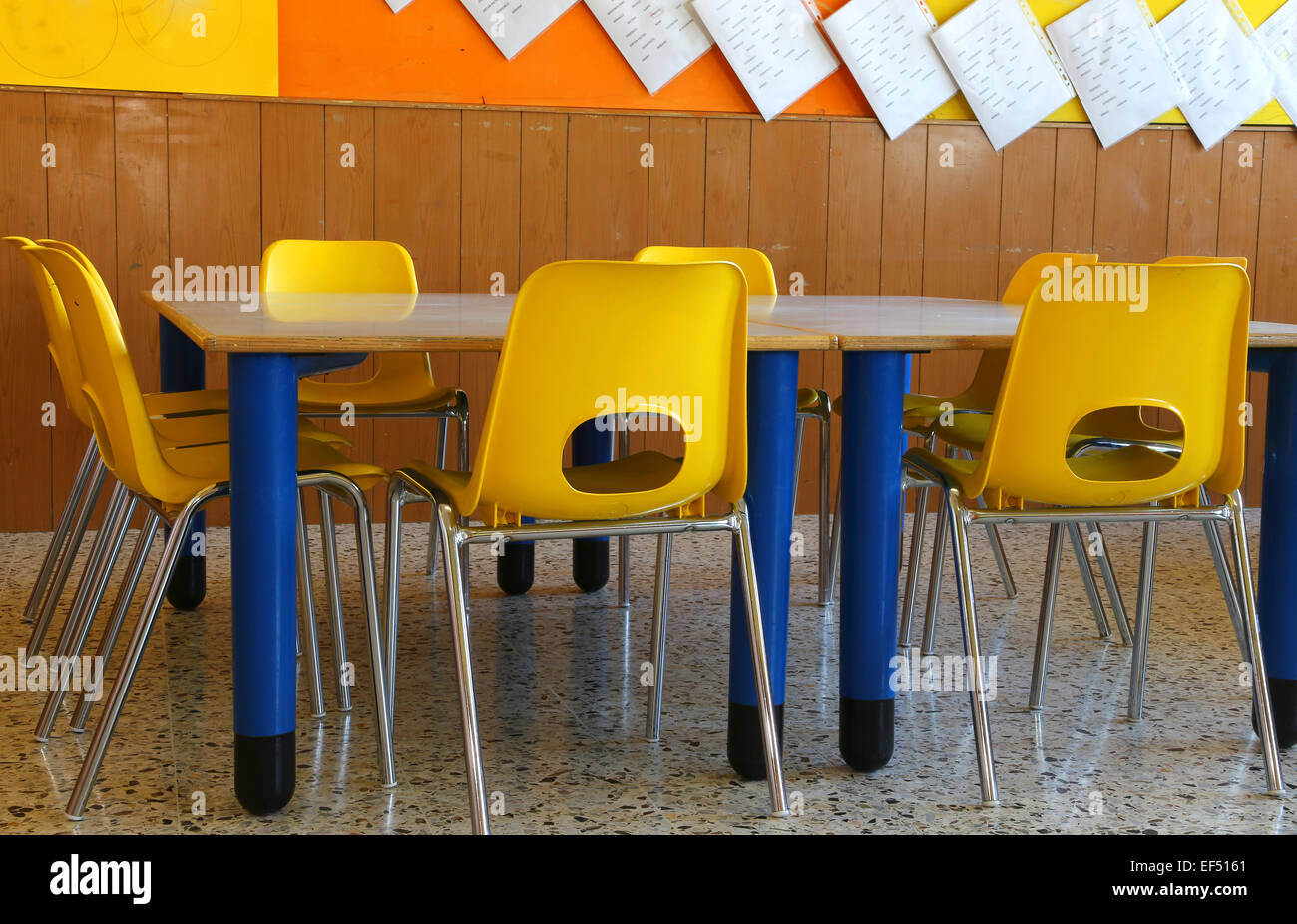 kindergarten classroom with yellow chairs and table Stock Photo - Alamy