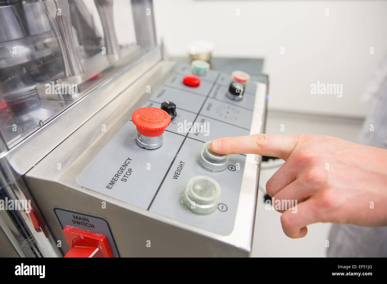 Button machine hi-res stock photography and images - Alamy