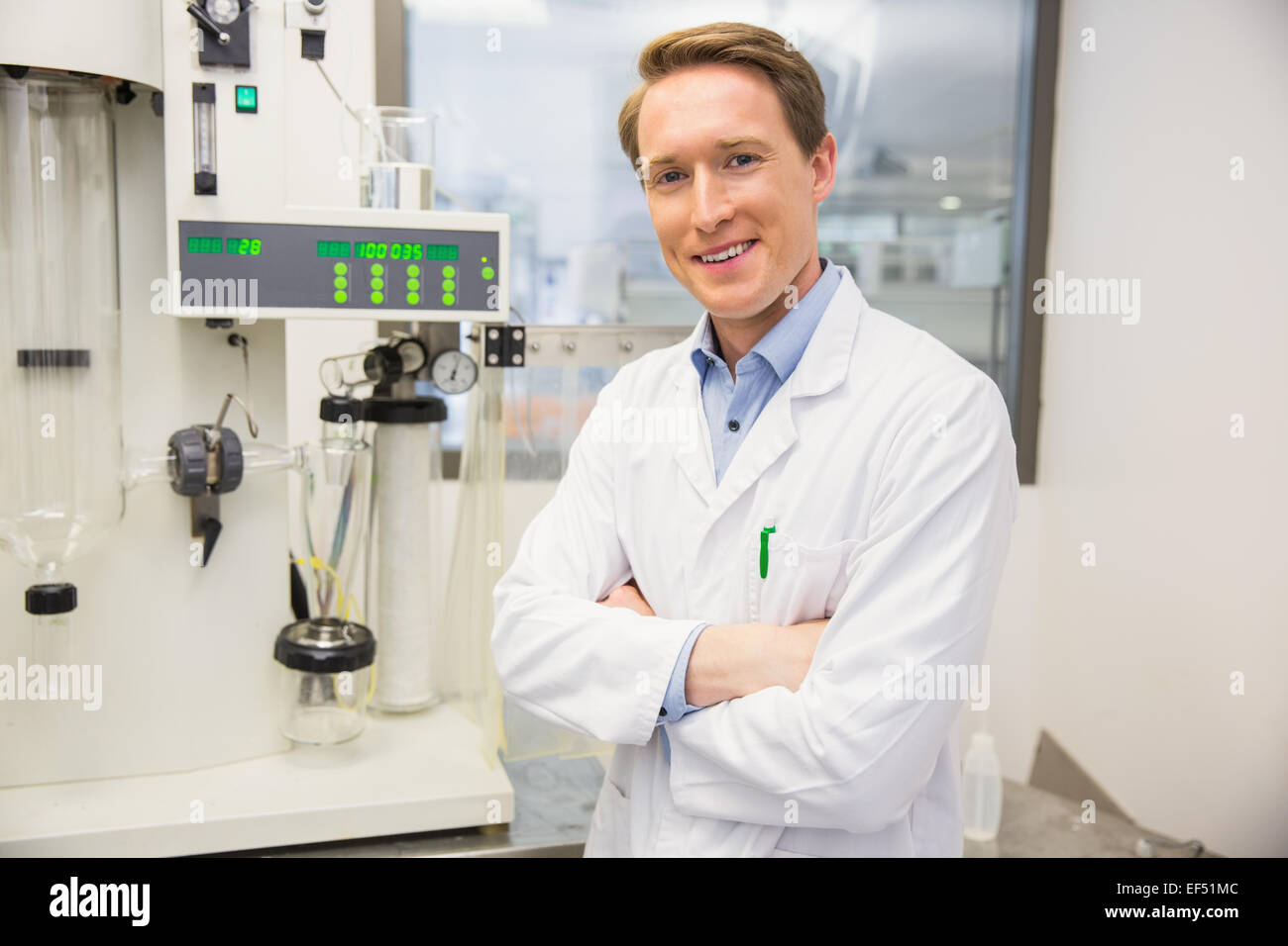 Happy pharmacist smiling at camera Stock Photo - Alamy