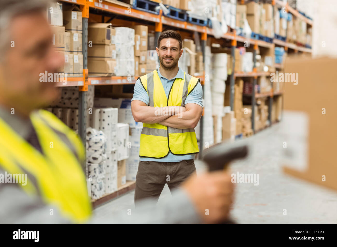 Warehouse worker scanning barcode on box Stock Photo - Alamy