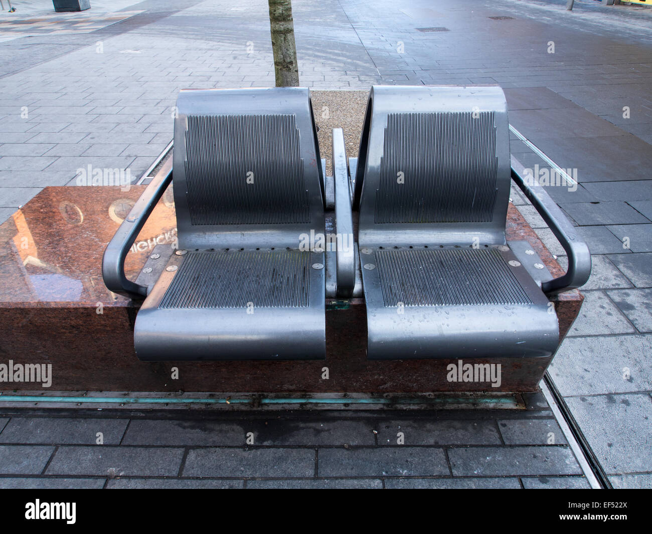 Street Furniture; Metal seats set on marble plinths in the High Street ...