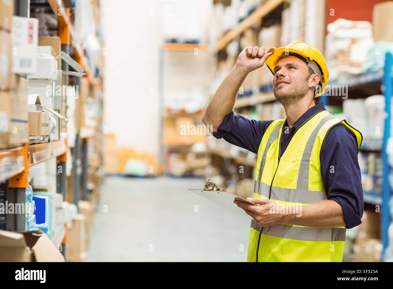 Portrait of warehouse worker with clipboard Stock Photo - Alamy
