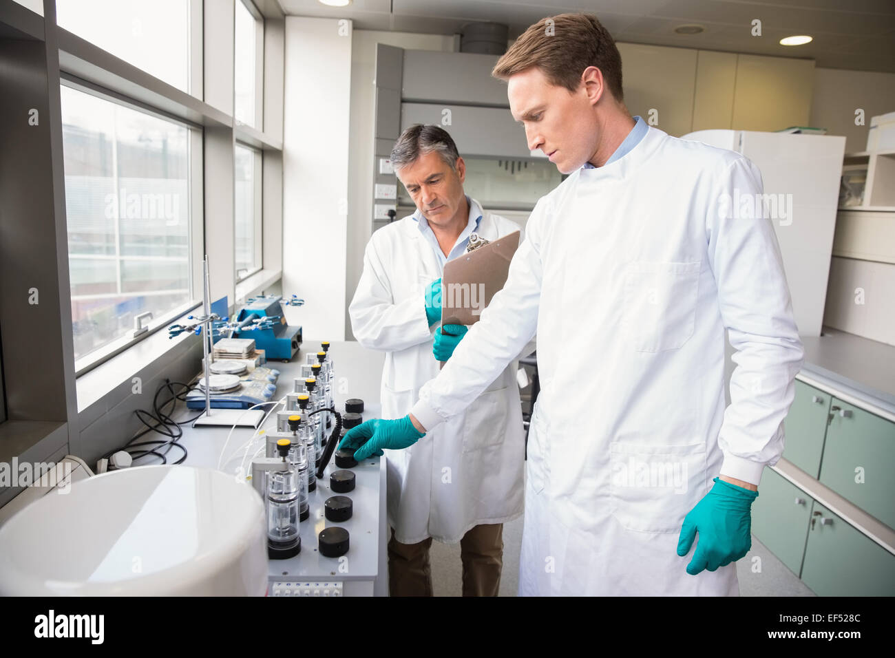 Team scientists working together hi-res stock photography and images ...
